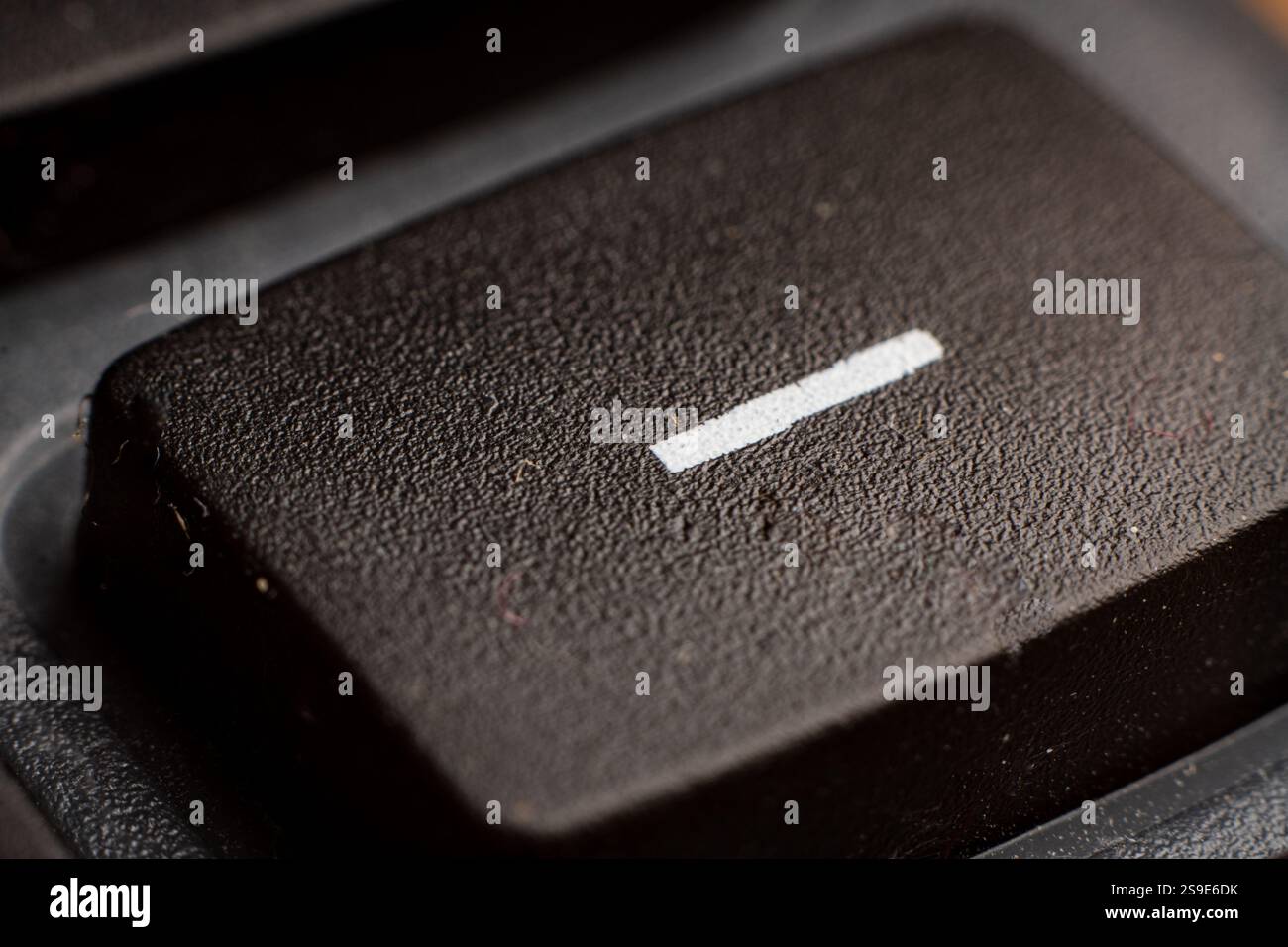 Closeup view of electronic keypad highlighting the minus button used ...