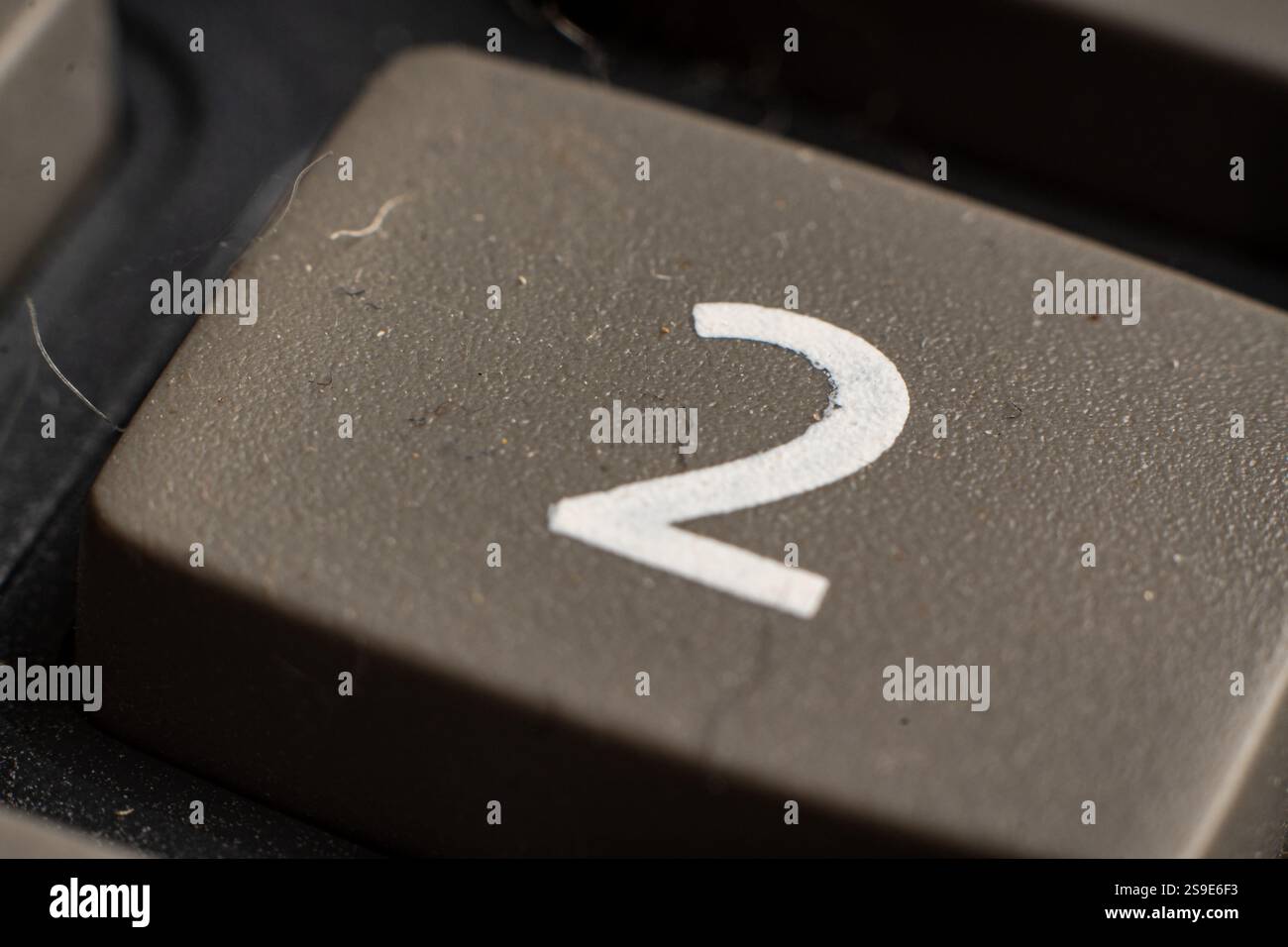 Closeup view of a calculator keypad showing the number two for ...