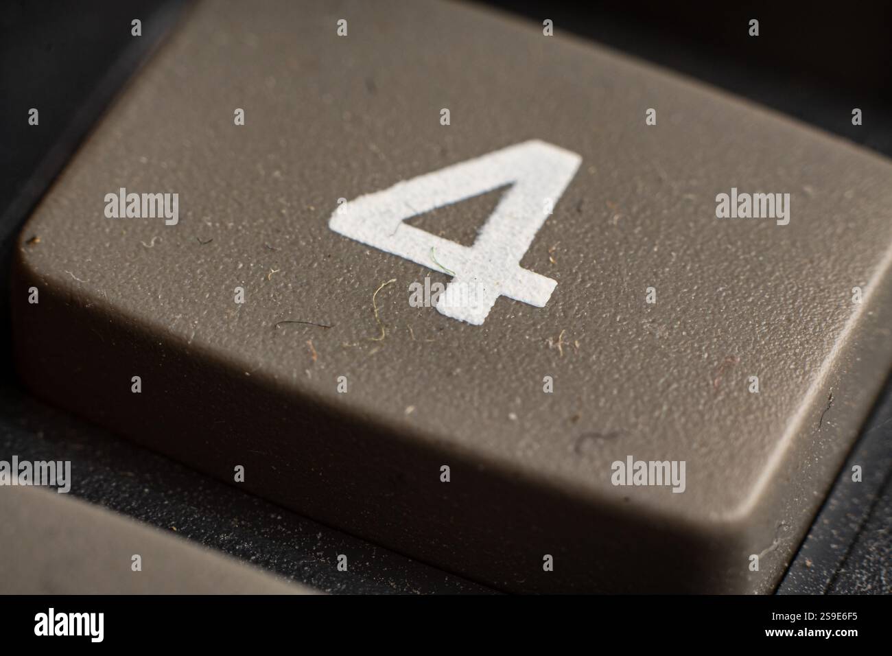 Closeup view of electronic keypad highlighting the number four button ...