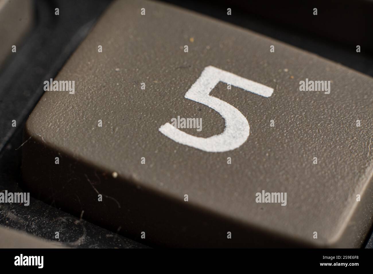 Closeup view of electronic keypad highlighting the number five button ...