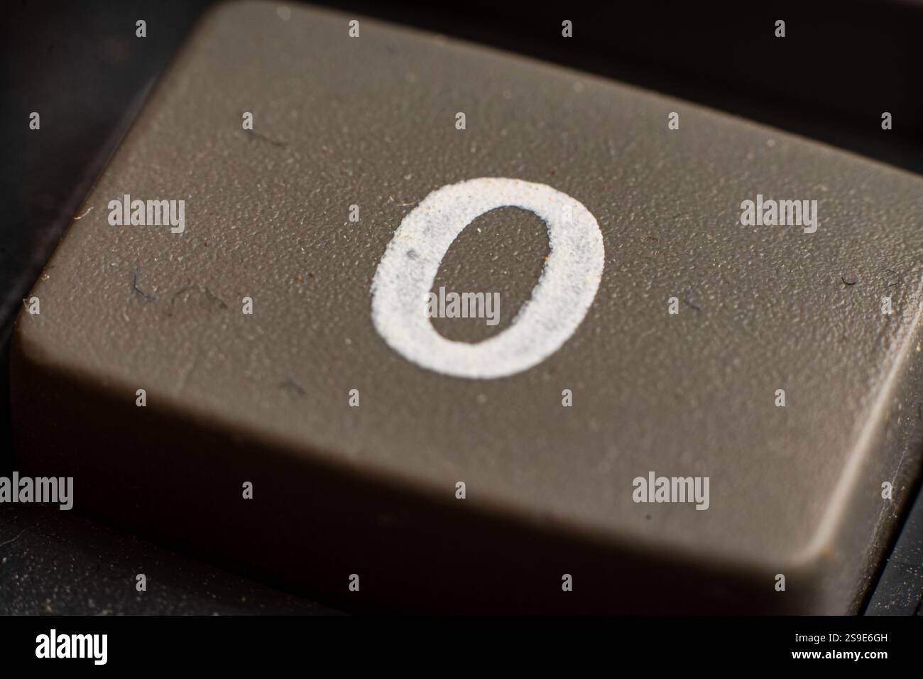 Closeup of a black calculator keypad button showing the number zero for ...
