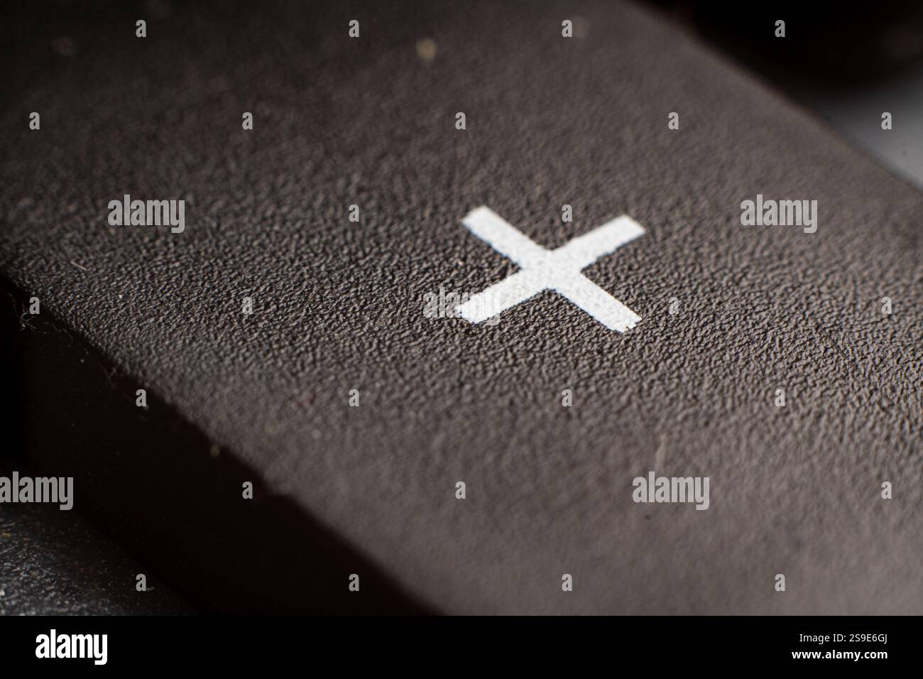 Closeup view of electronic keypad highlighting the plus addition button ...