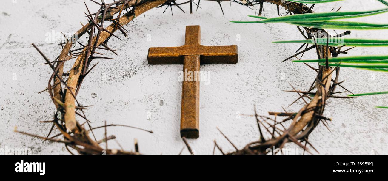 Palm leaves, crown of thorns, and cross on gray background for Sunday ...
