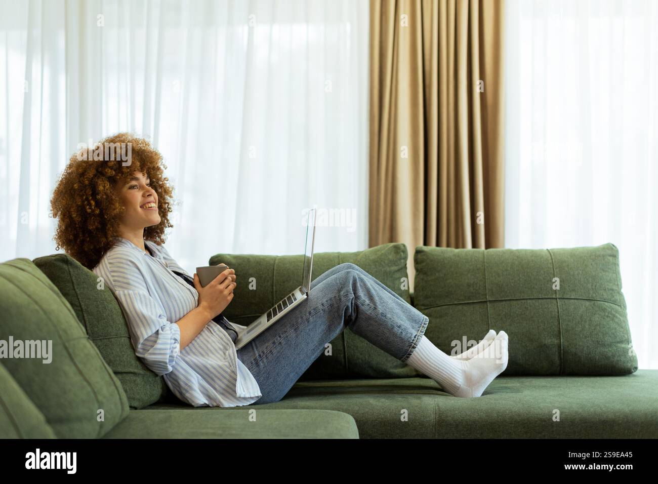 Woman comfortably sitting on soft hi-res stock photography and images ...