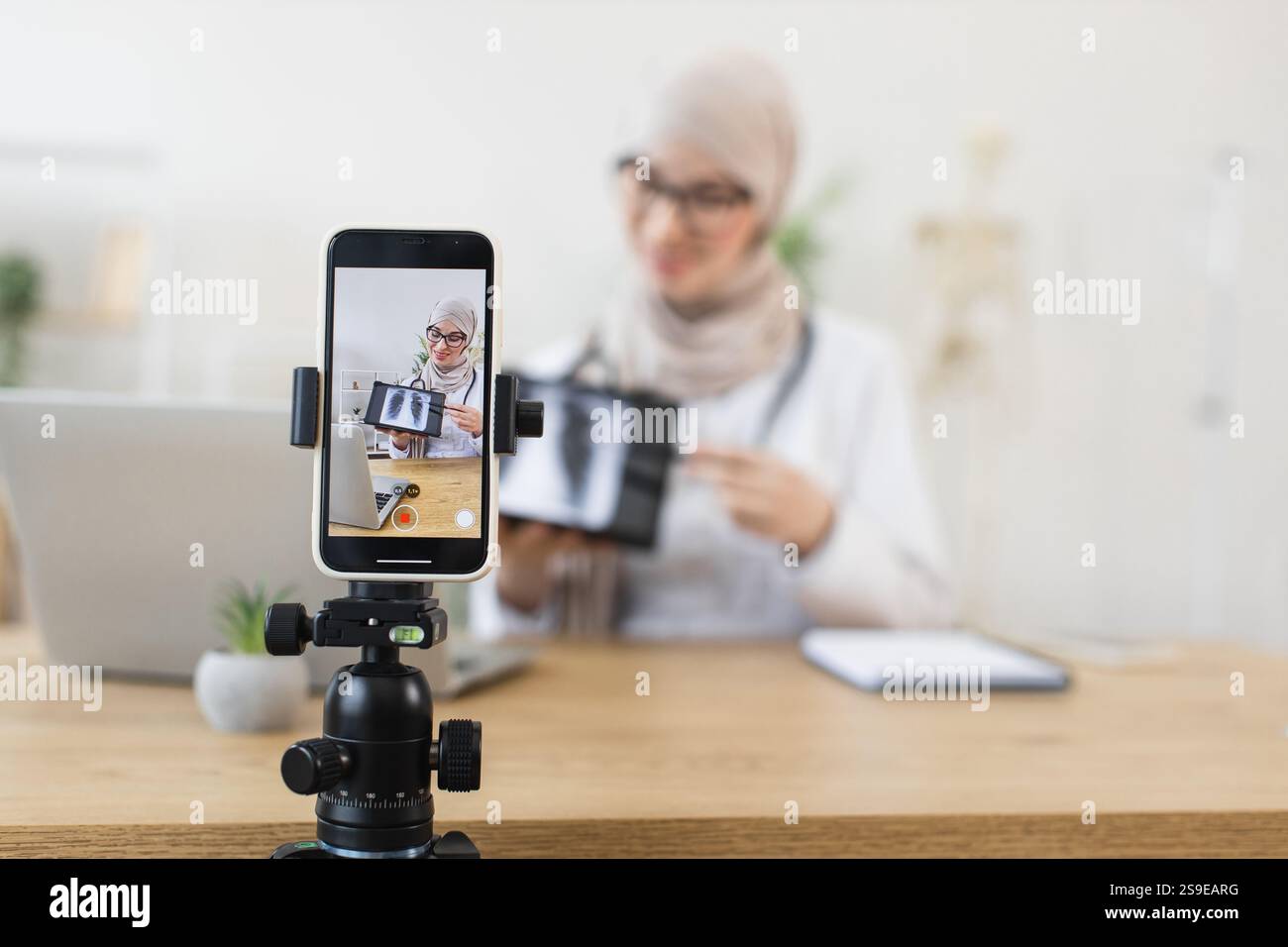 Middle-Eastern Muslim woman blogger records informative video lesson ...