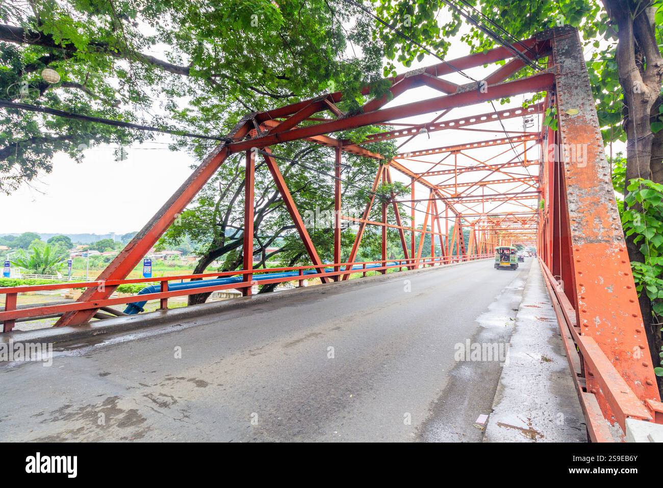 The steel Carmen Bridge stretches across the Cagayan de Oro River ...