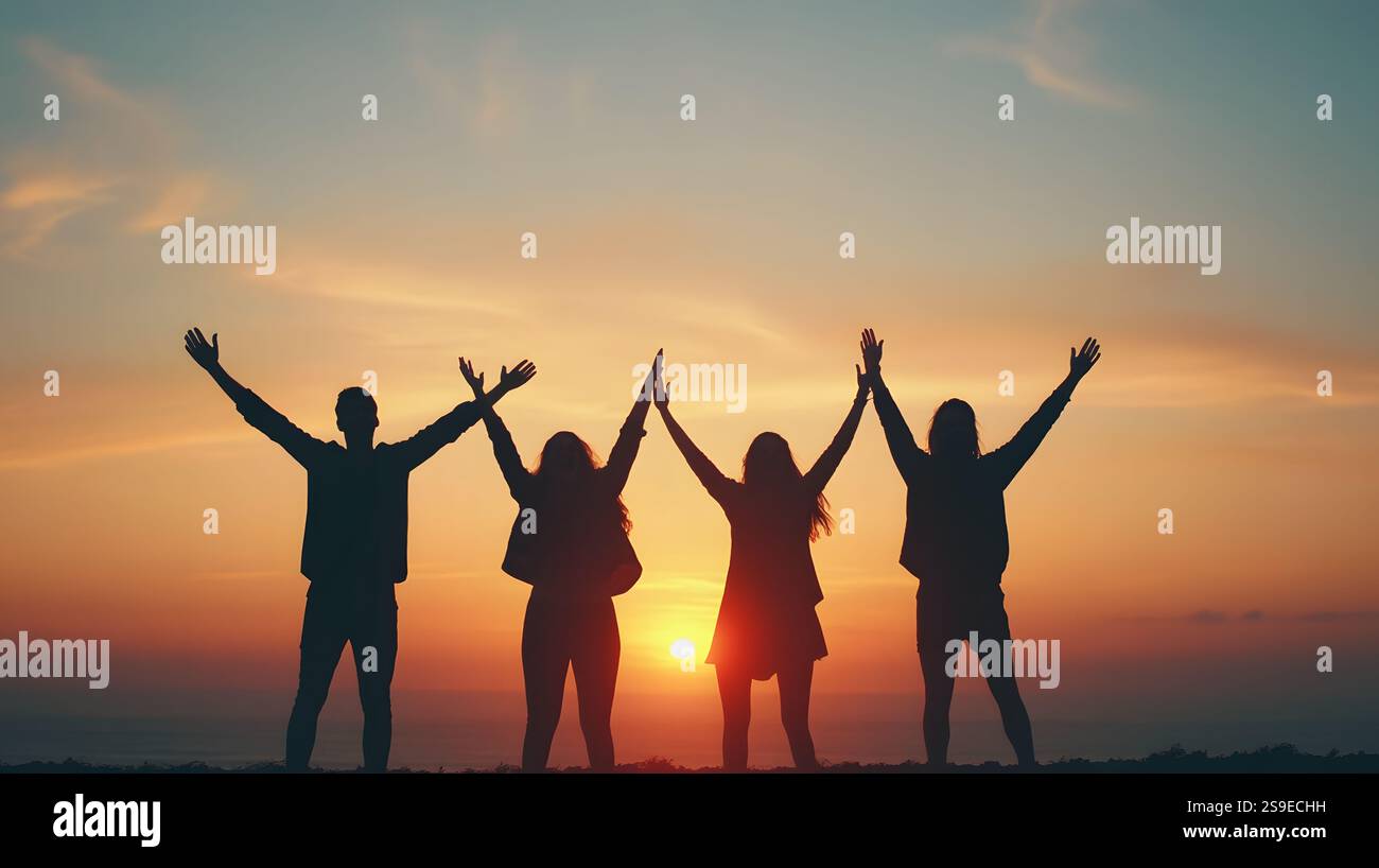 A group of friends raising their arms together,their silhouettes ...