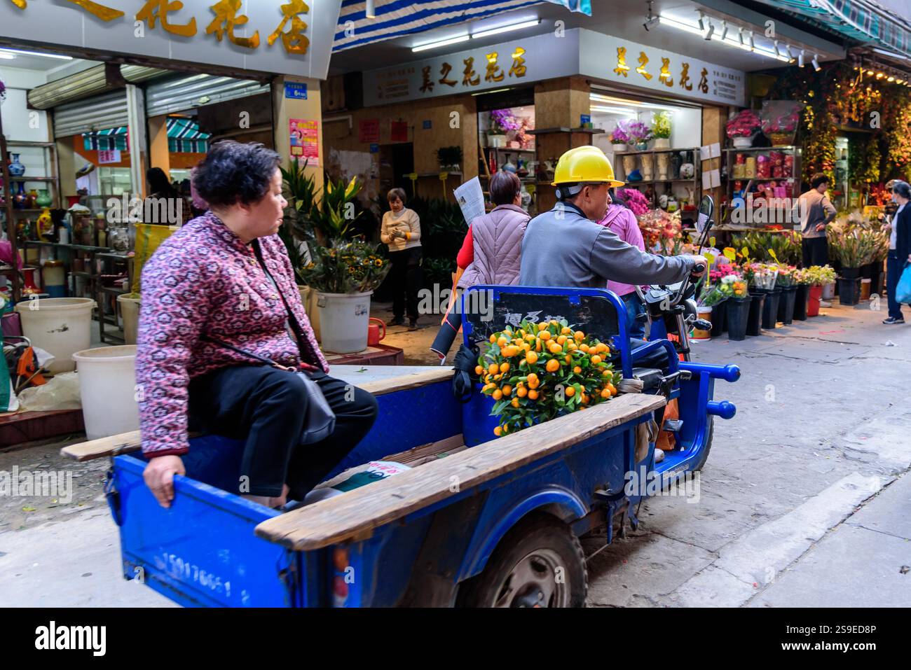 People stroll in a flower market in Dongguan City, south China's ...