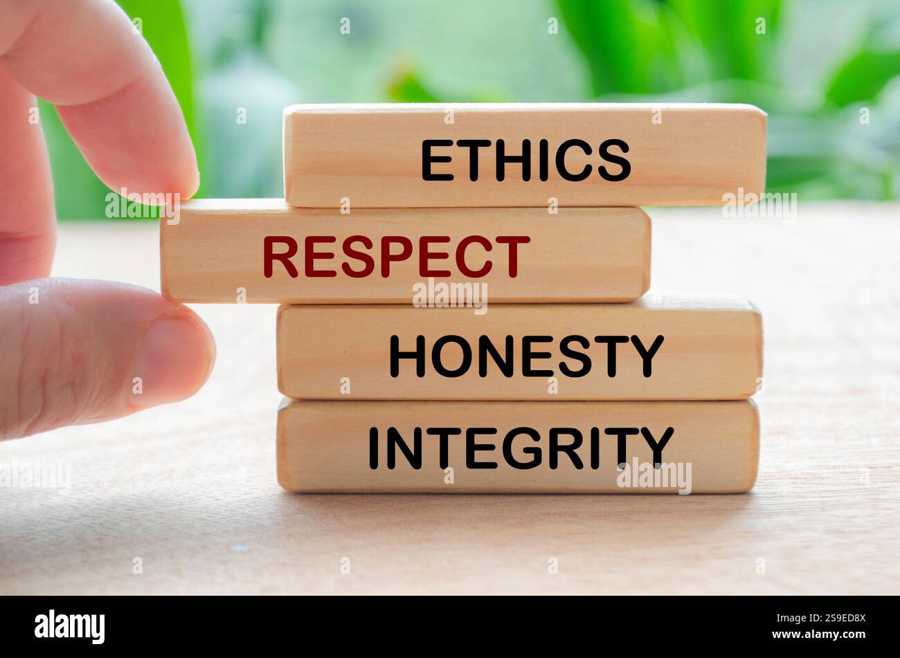 Ethics, respect, honesty and integrity text on wooden blocks with ...