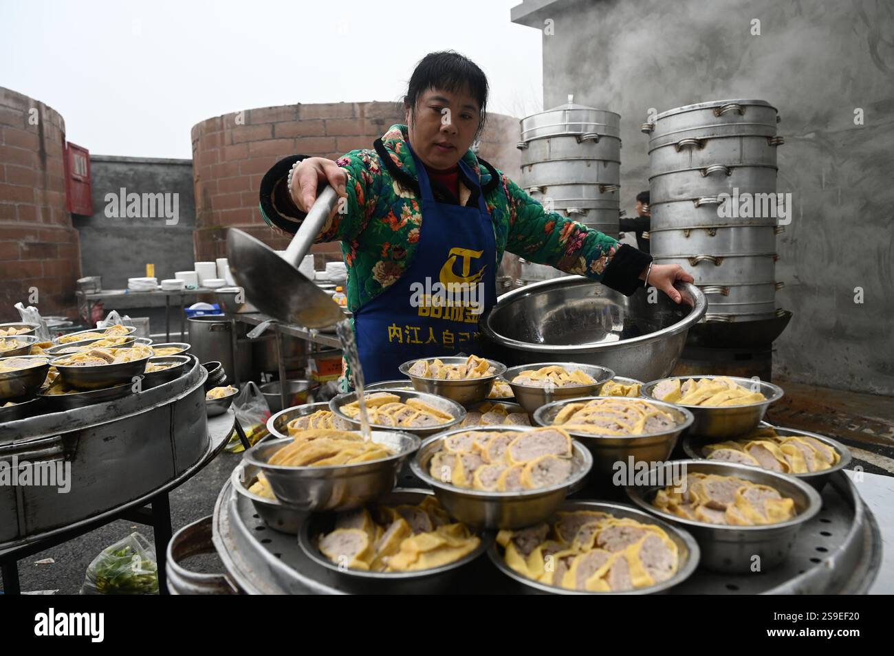 Residents gather at a Baba banquet in Neijiang City, southwest China's ...