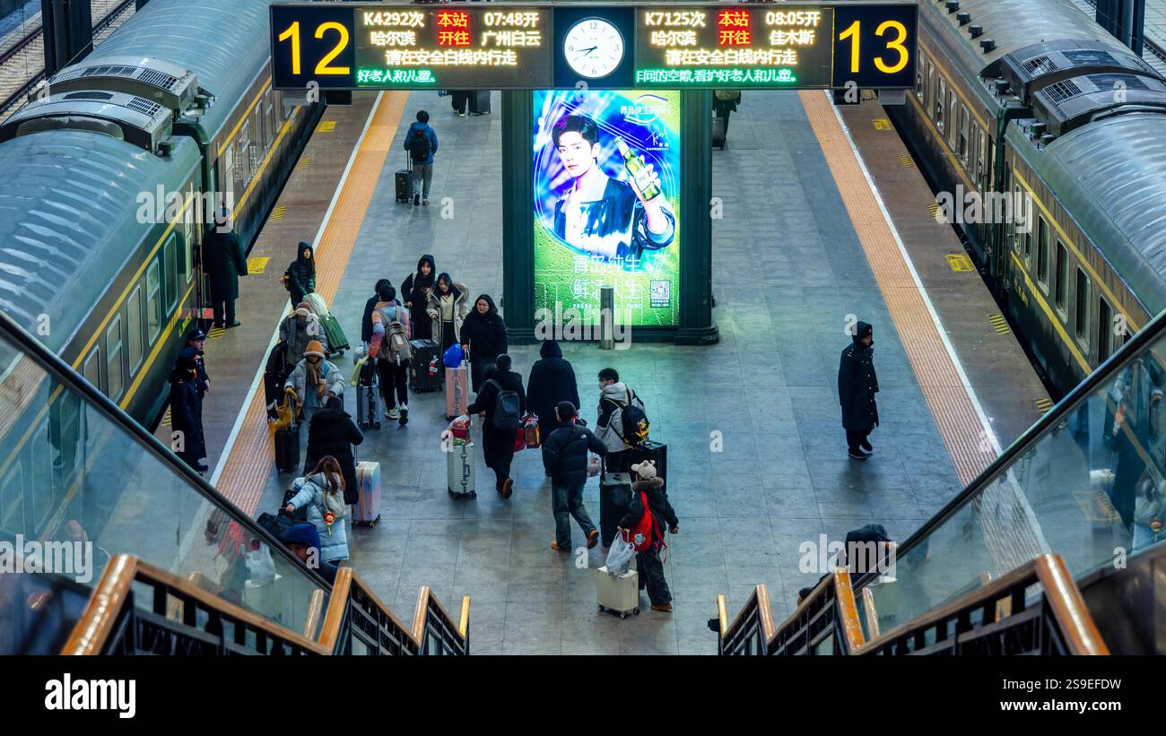 Passengers are seen at Harbin railway station in Harbin City, northeast ...