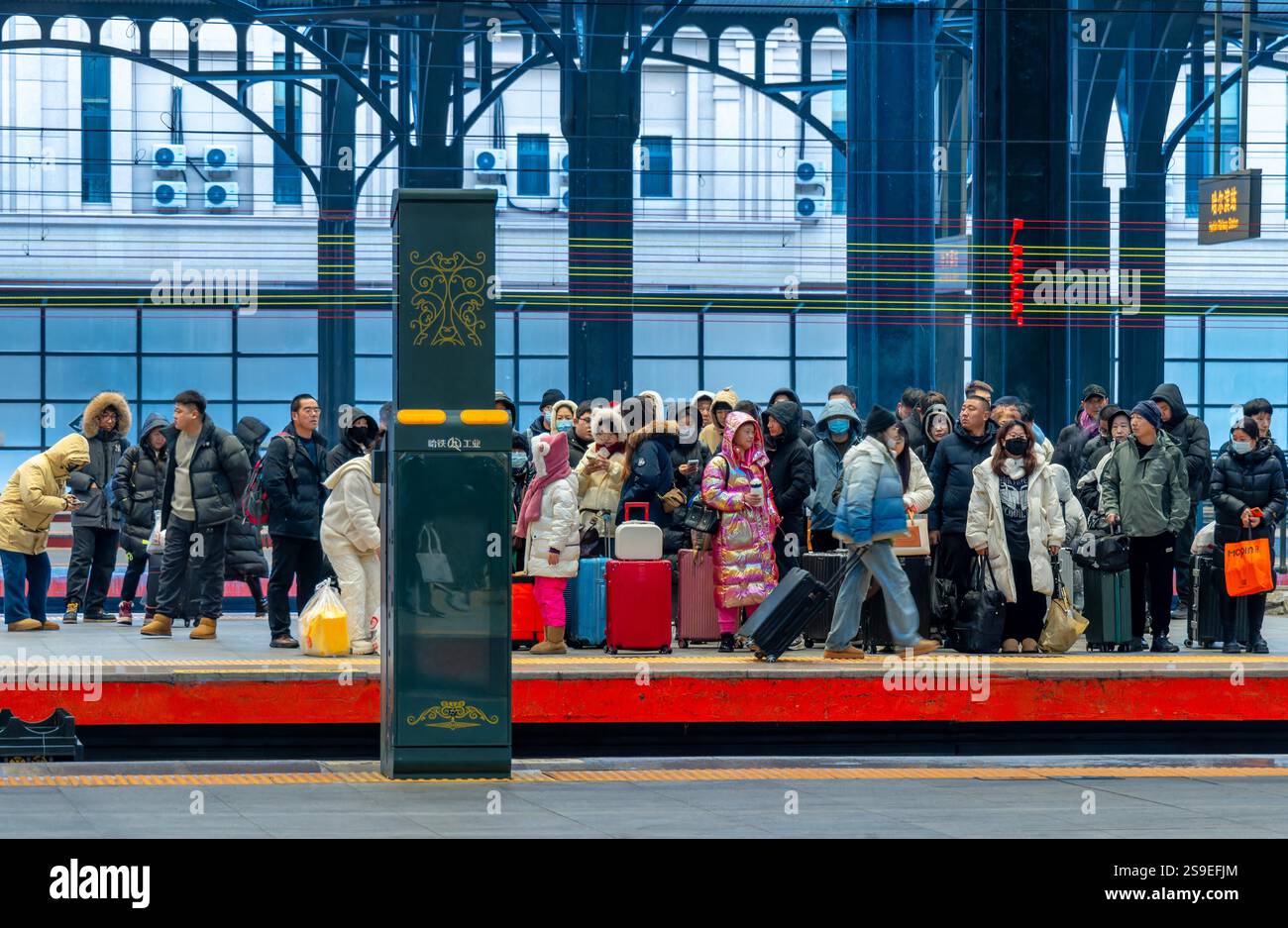Passengers are seen at Harbin railway station in Harbin City, northeast ...