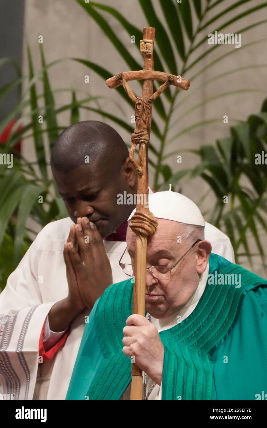 Pope Francis holds the pastoral staff as he presides over a mass on the ...