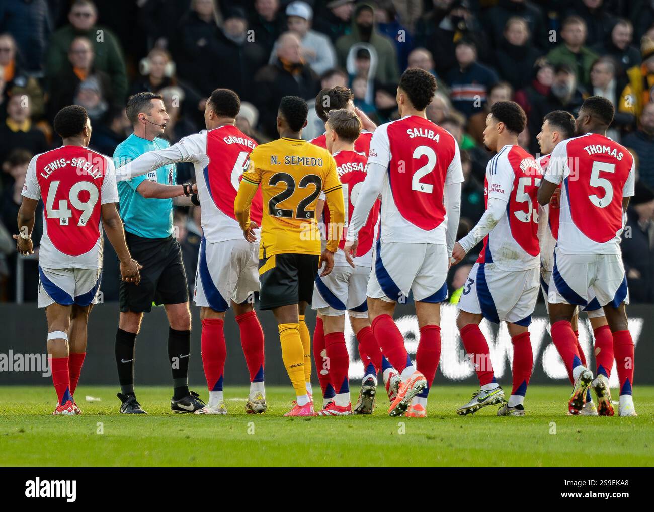 Wolverhampton, England, 25th January 2025. Arsenal players surround ...
