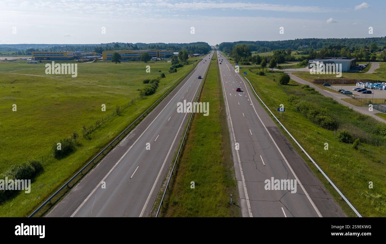 Aerial view of a highway with two lanes in each direction, separated by ...