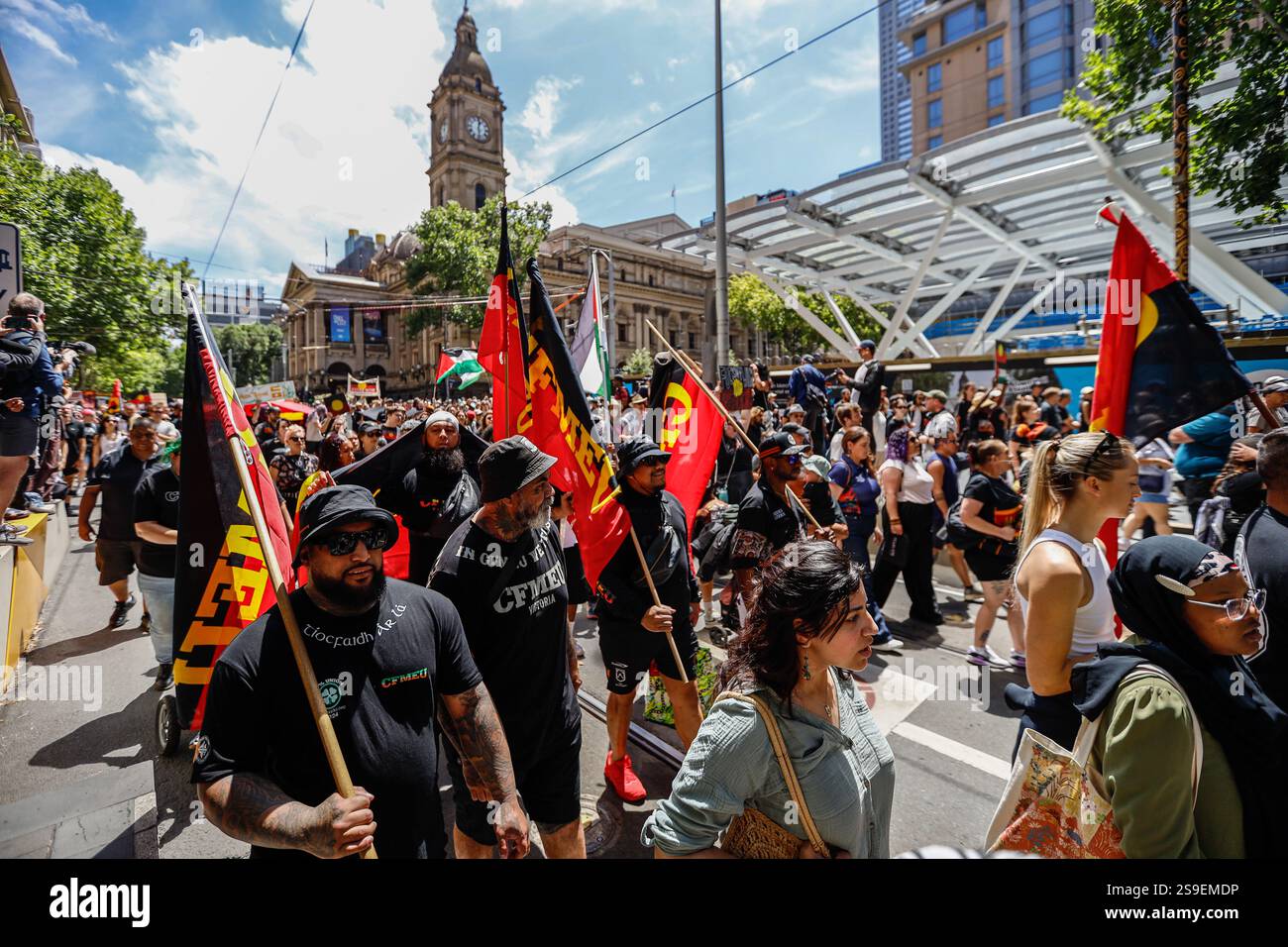 Protesters hold flags during the annual Invasion Day protest ...