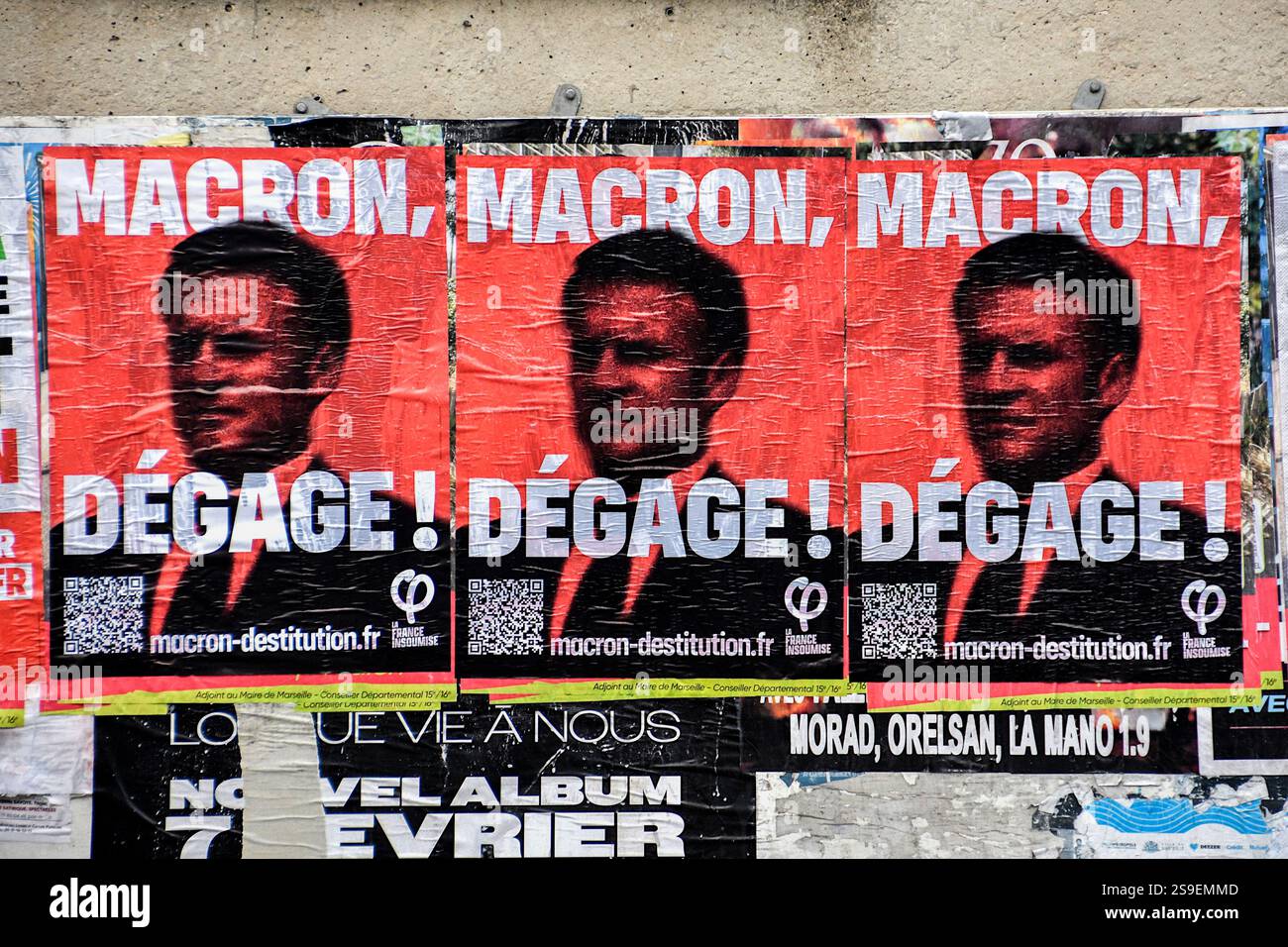 Posters of the far-left party La France Insoumise (LFI) saying "Macron ...