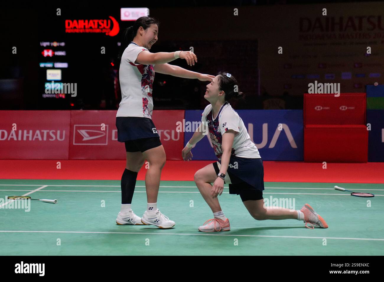 South Korea's Kim Hye Jeong, right, and Kong Hee Yong celebrate after defeating Malaysia's ...