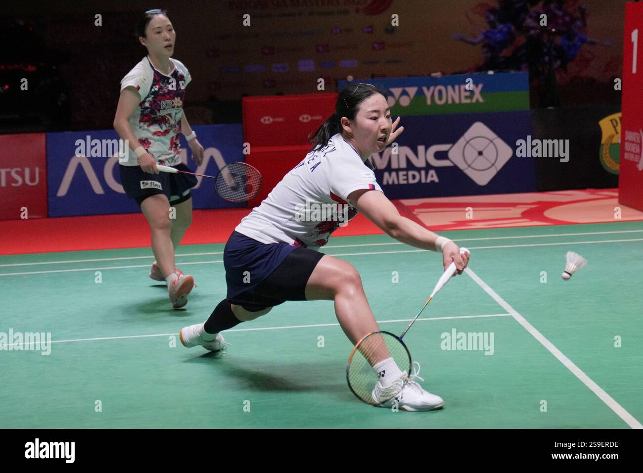South Korea's Kim Hye Jeong, left, and Kong Hee Yong play against Malaysia's Pearly Tan and ...