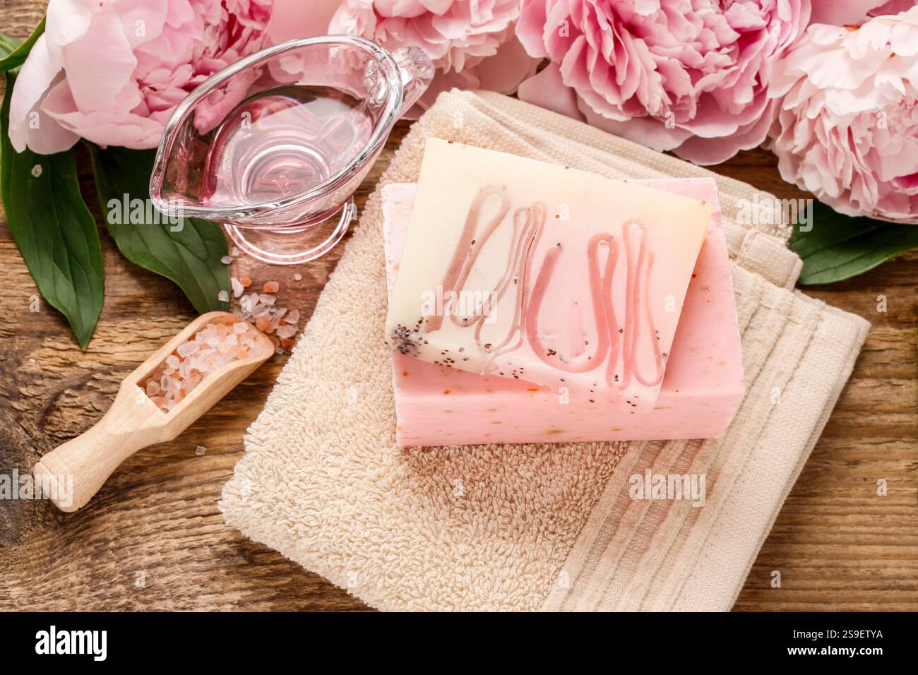 Bars of handmade soap, soft towels and liquid soap, spa time Stock ...