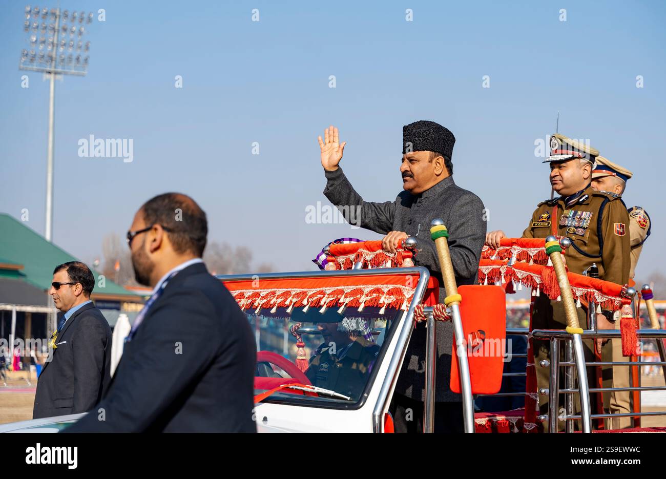 Chief Guest, Deputy Chief Minister Surinder Kumar waves as he is ...