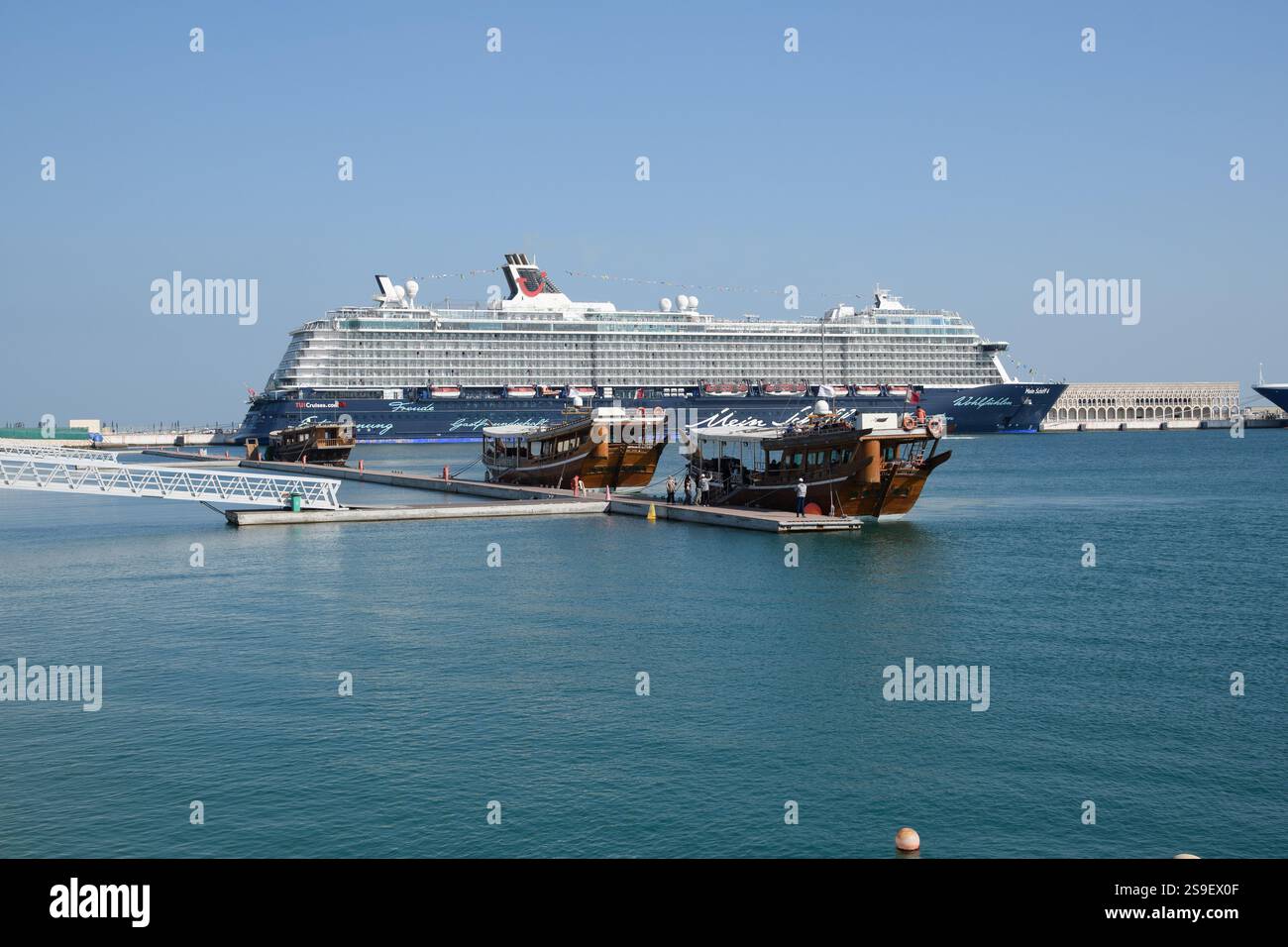 Doha, Qatar - January 4, 2025: Sunset casts a golden hue on the skyline ...