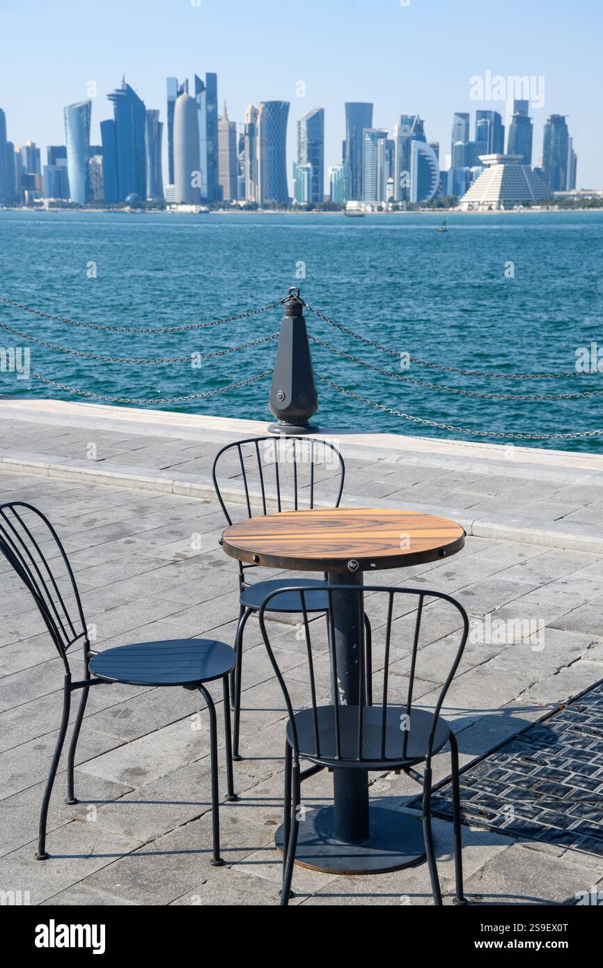 Doha, Qatar - January 4, 2025: A serene waterfront view with a modern ...