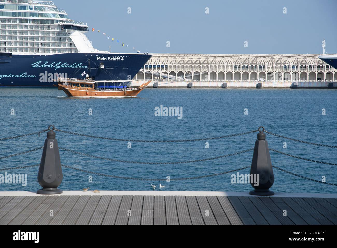Doha, Qatar - January 4, 2025: A traditional dhow boat takes tourists ...