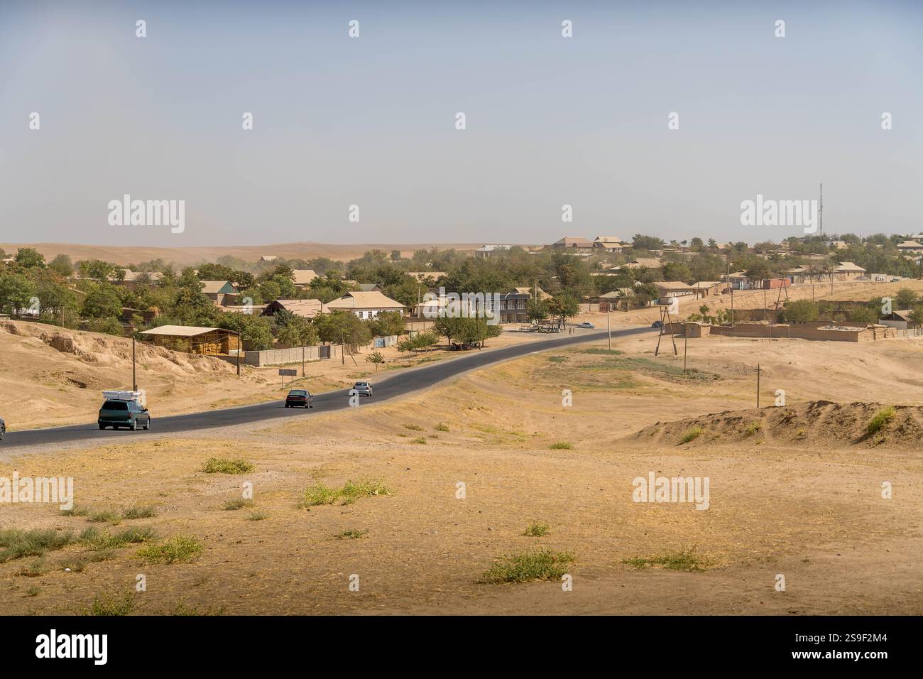 The view of the Tajik village of Dangara in Central Asia with houses ...