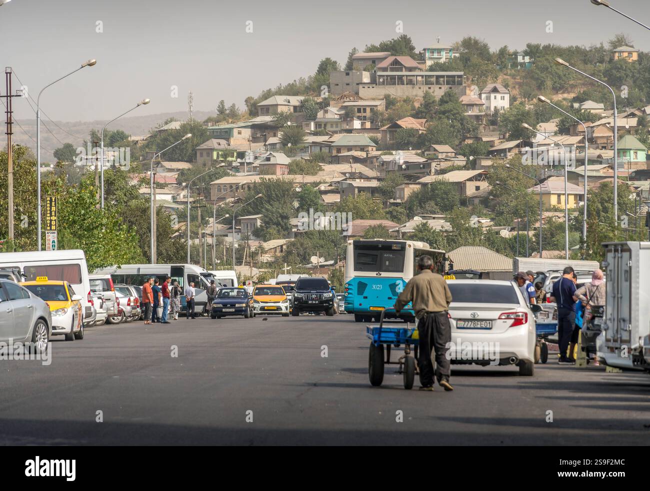 The cars and local Tajik people on the streets of Dushanbe, Tajikistan ...