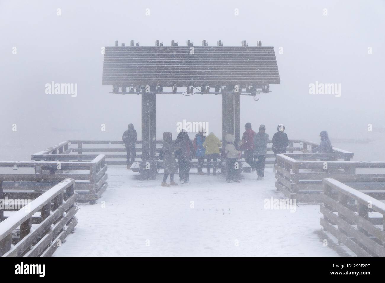 YANTAI, CHINA - JANUARY 9, 2025 - Tourists brave the wind and snow to ...