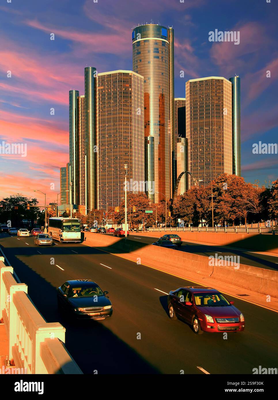 An urban cityscape featuring a towering modern building complex ...