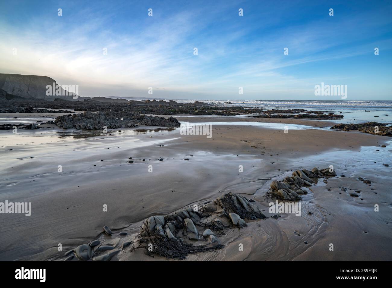 January morning light on Northcott Mouth beach in Cornwall Stock Photo ...