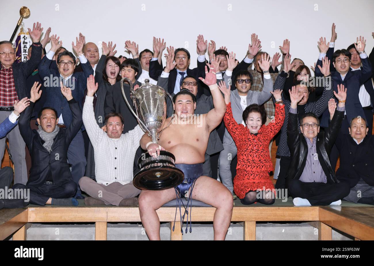 Ozeki Hoshoryu (C) celebrates after winning the 15-day New Year Grand ...