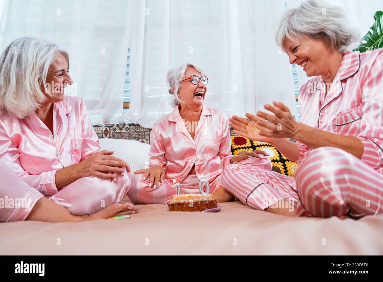 Beautiful senior women having funny pajama party at home - Group of ...