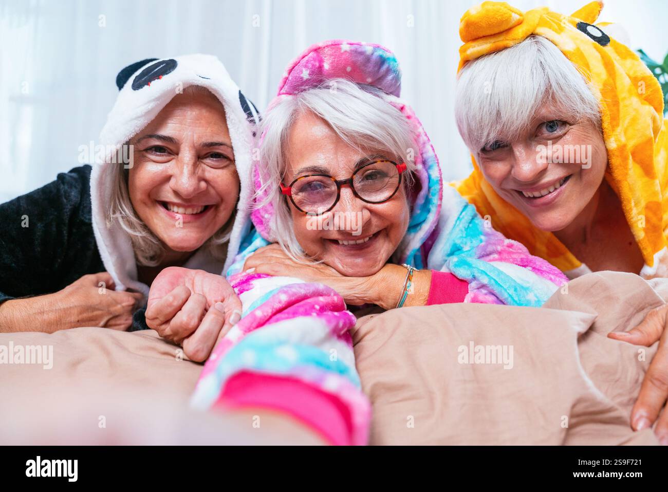 Beautiful senior women having cool pajama party at home - Group of ...