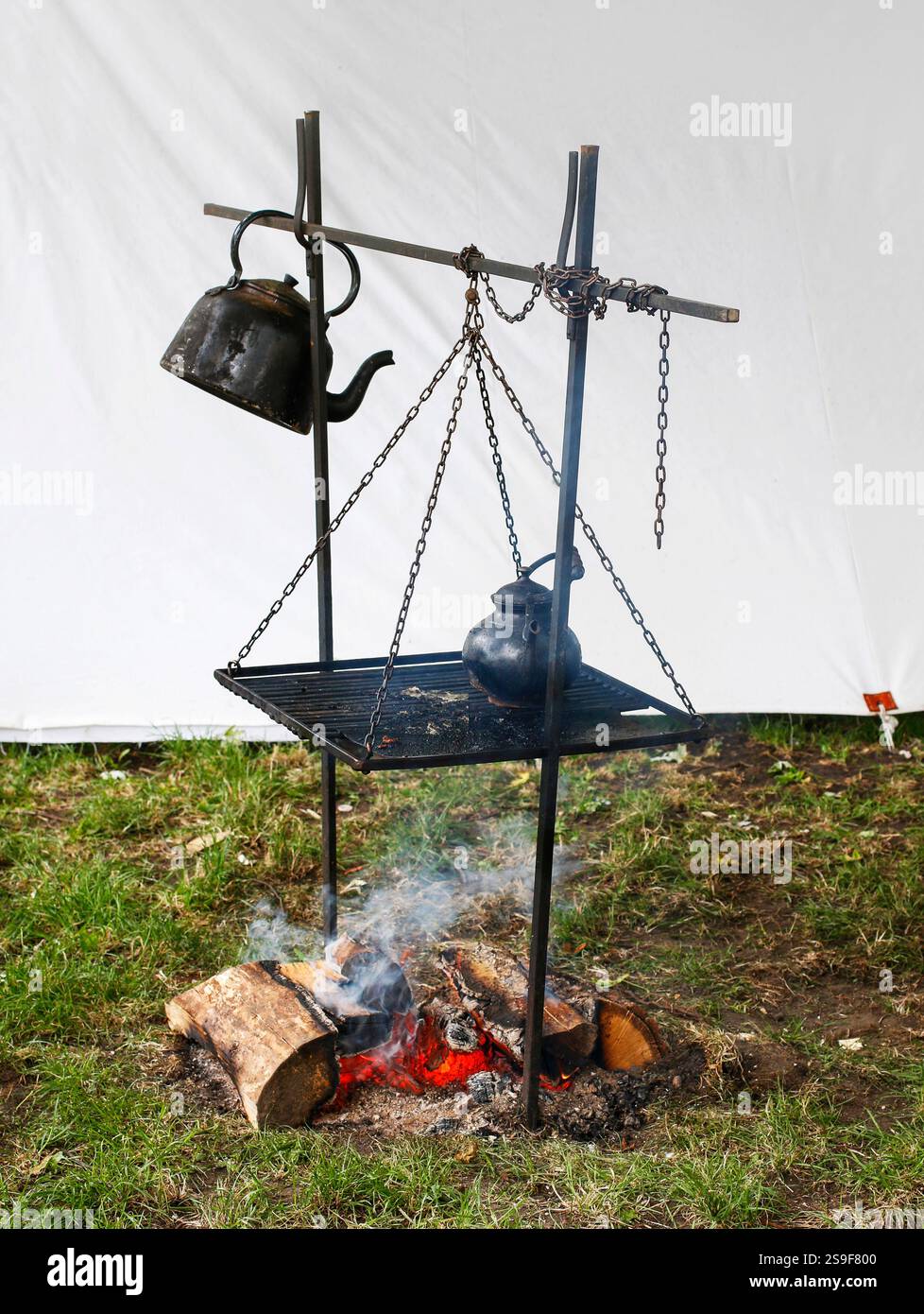 Medieval campfire on grass, historical object Stock Photo - Alamy
