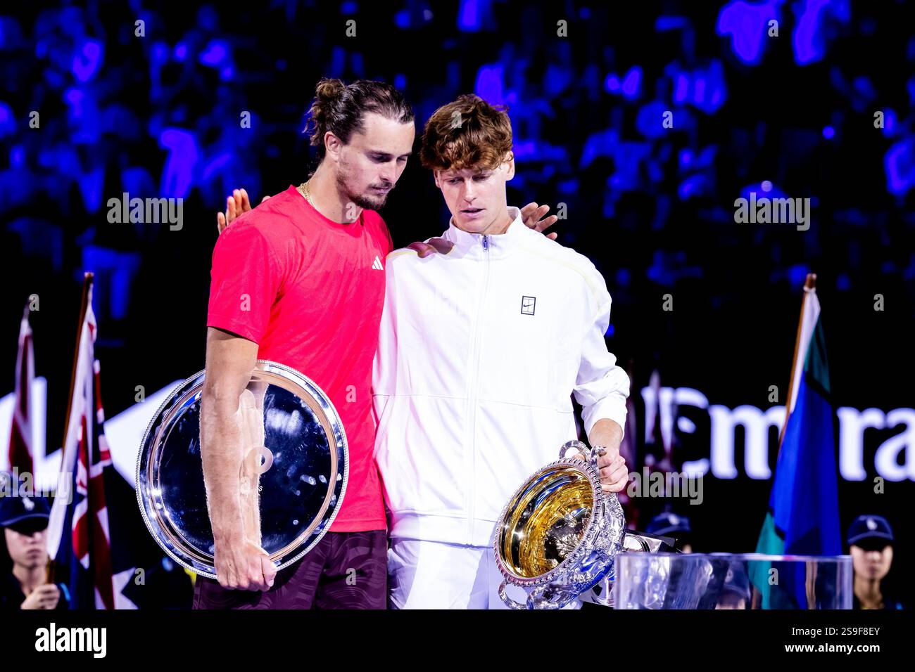 MELBOURNE, VIC - JANUARY 26: Jannik Sinner of Italy and Alexander Zverev of Germany stand with ...