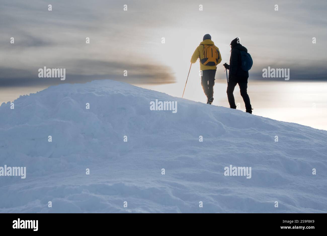 Colorful silhouette of skier standing on slope, Kasprowy Wierch Peak in ...
