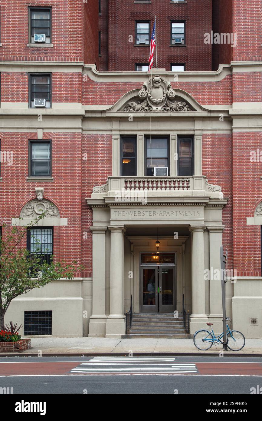 A bike and the facade of the Webster Apartments brick building in ...