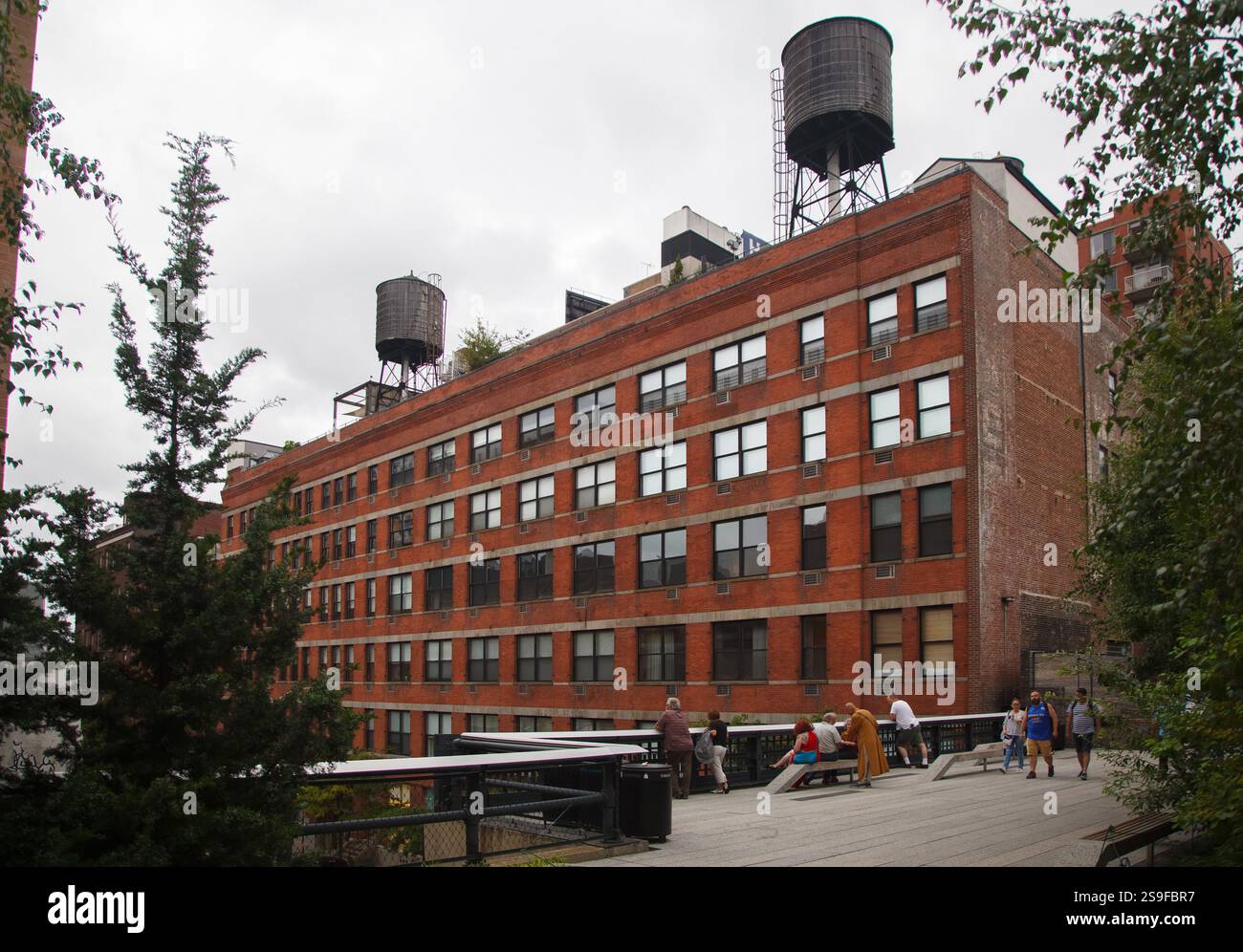 A Red Brick historical building with two water tanks at the High Line ...