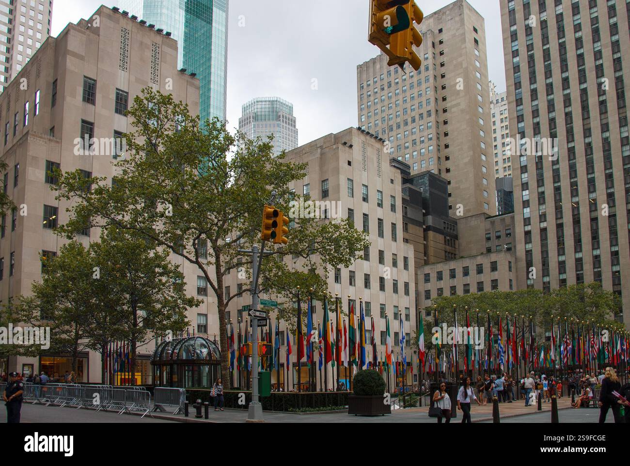 The Rockefeller square with the flags of the world in Midtown Manhattan ...