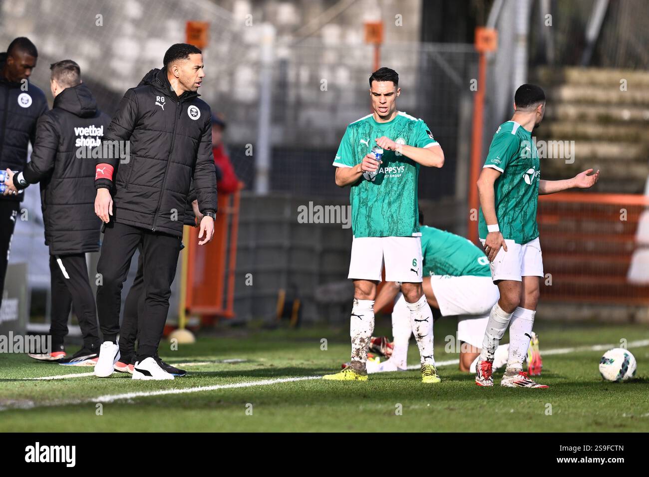Lommel's head coach Ryan Garry and Lommel's Joey Pelupessy pictured ...