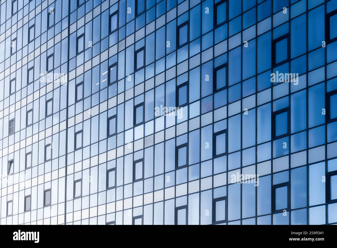 This modern architecture showcases a unique grid of reflective glass ...