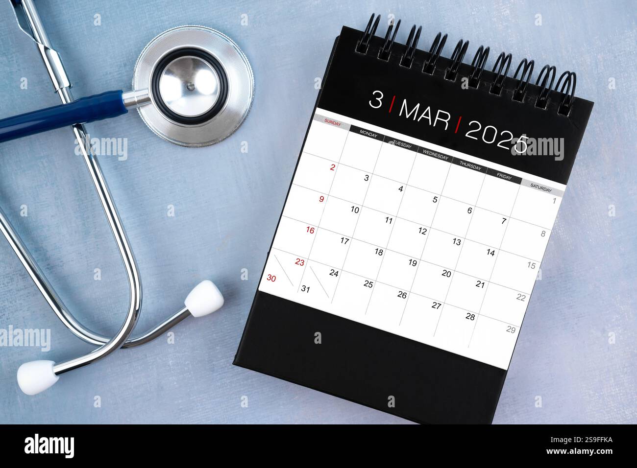 March 2025 desk calendar and stethoscope, Medical appointment schedule ...