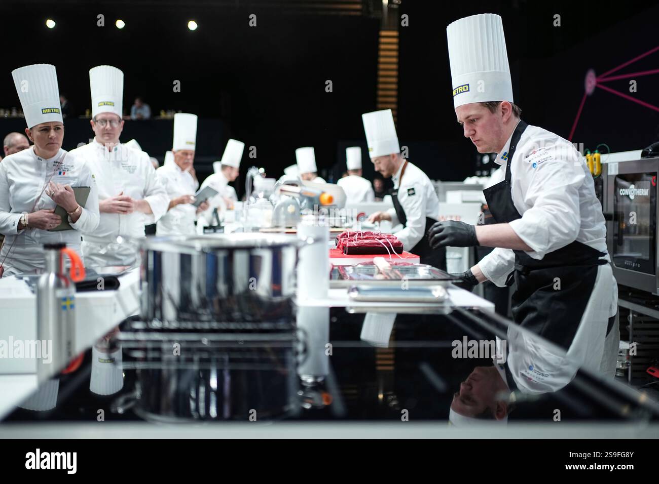 Sweden chef Gustav Leonhardt, right, prepares food during the final of ...