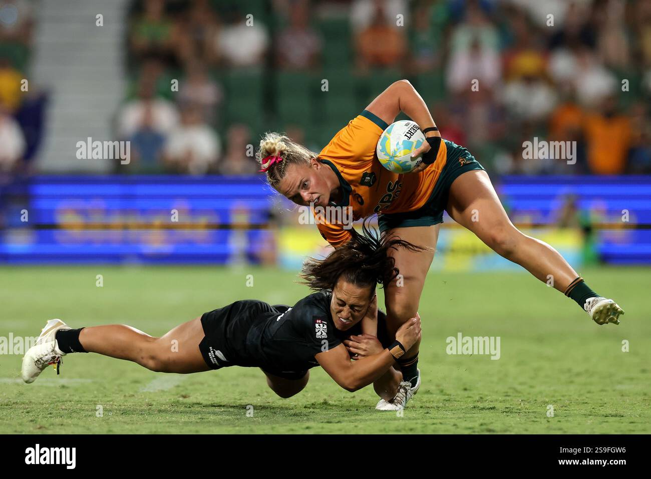 Perth, Australia. 26th Jan, 2025. Heidi Dennis of Australia avoids a ...