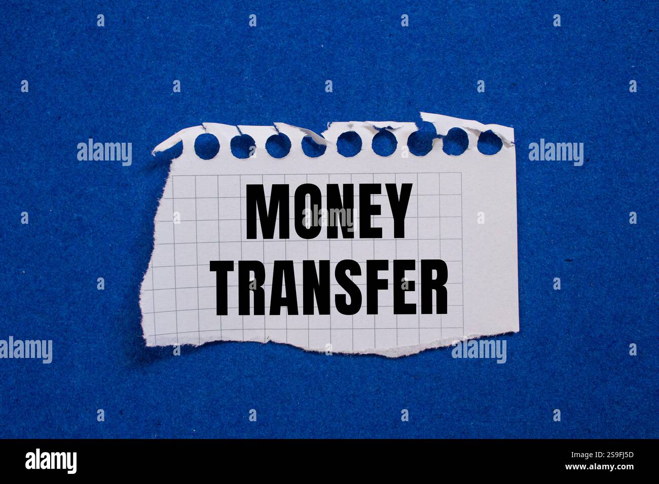 Money transfer message written on ripped torn paper piece with blue ...