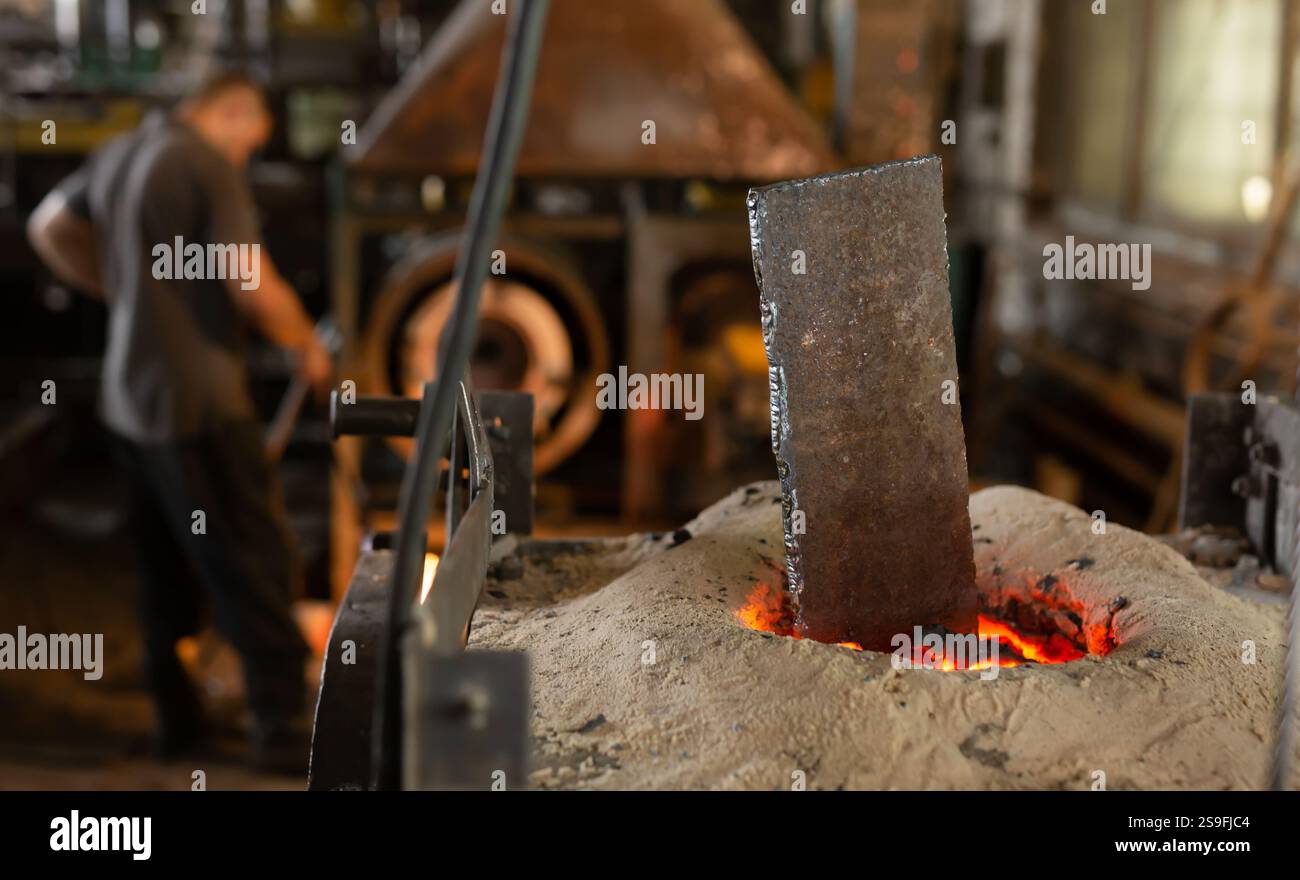 Foundry - ferrous metal is melted in an induction furnace of ...
