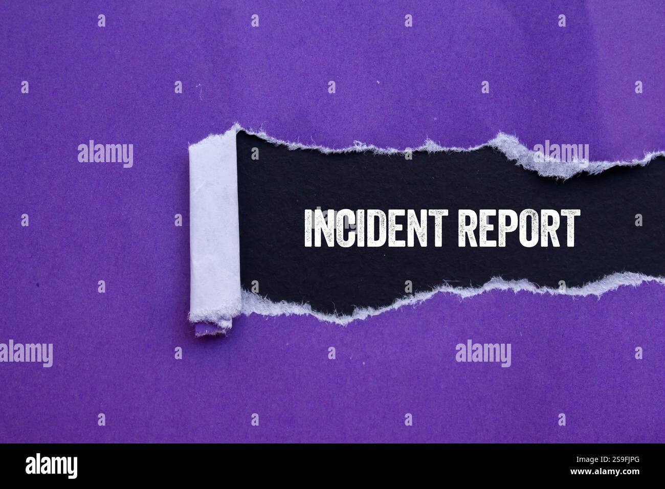 Incident report message written on ripped torn purple paper on black background. Conceptual ...